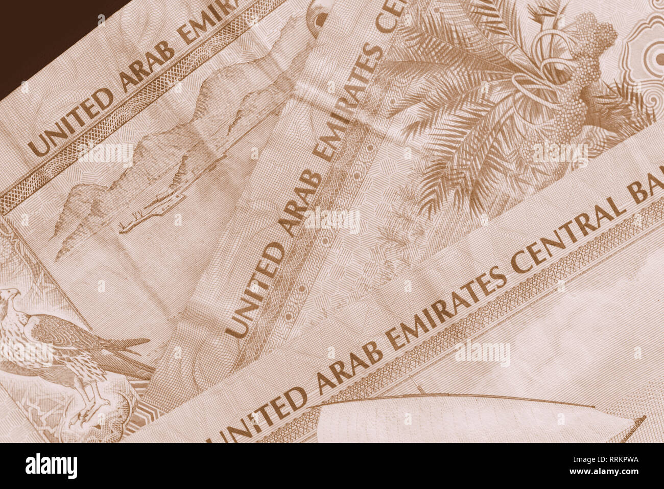 UAE dirham currency background close up. Brown color toned Stock Photo ...