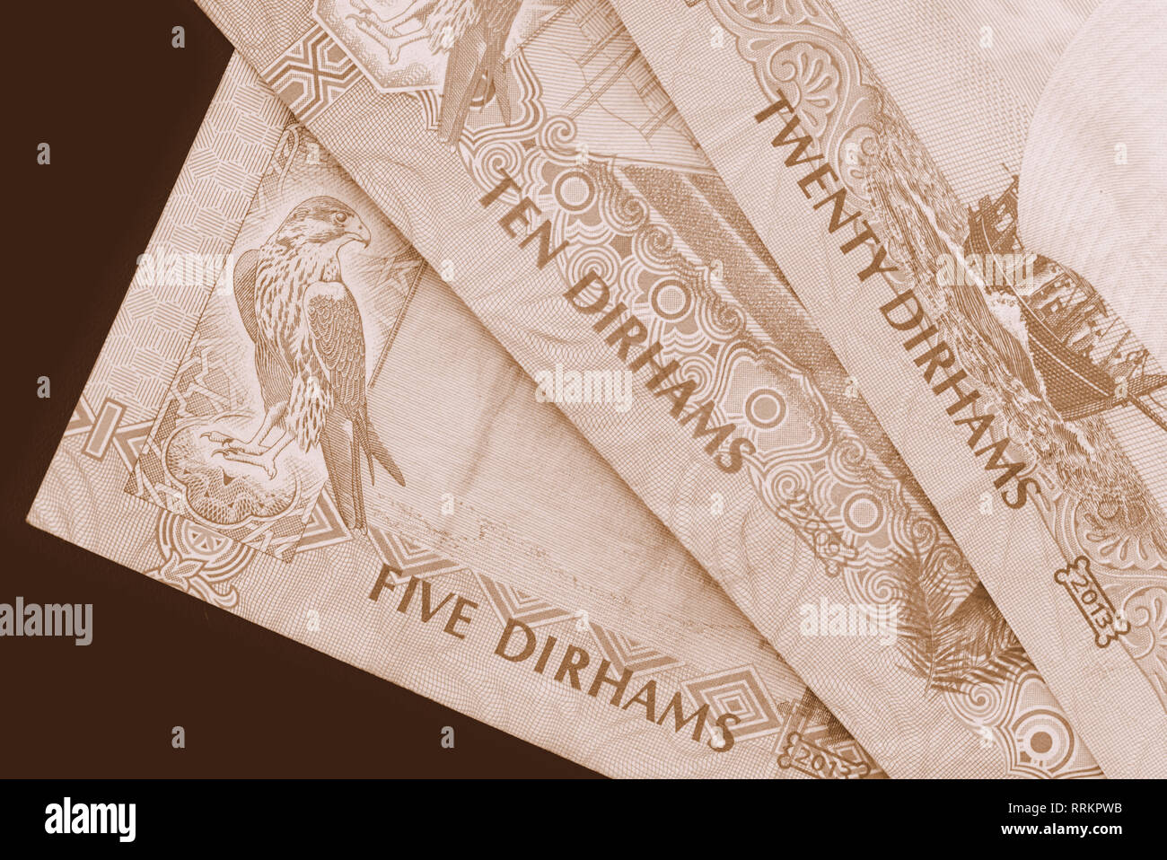 UAE dirham currency background close up. Brown color toned Stock Photo ...