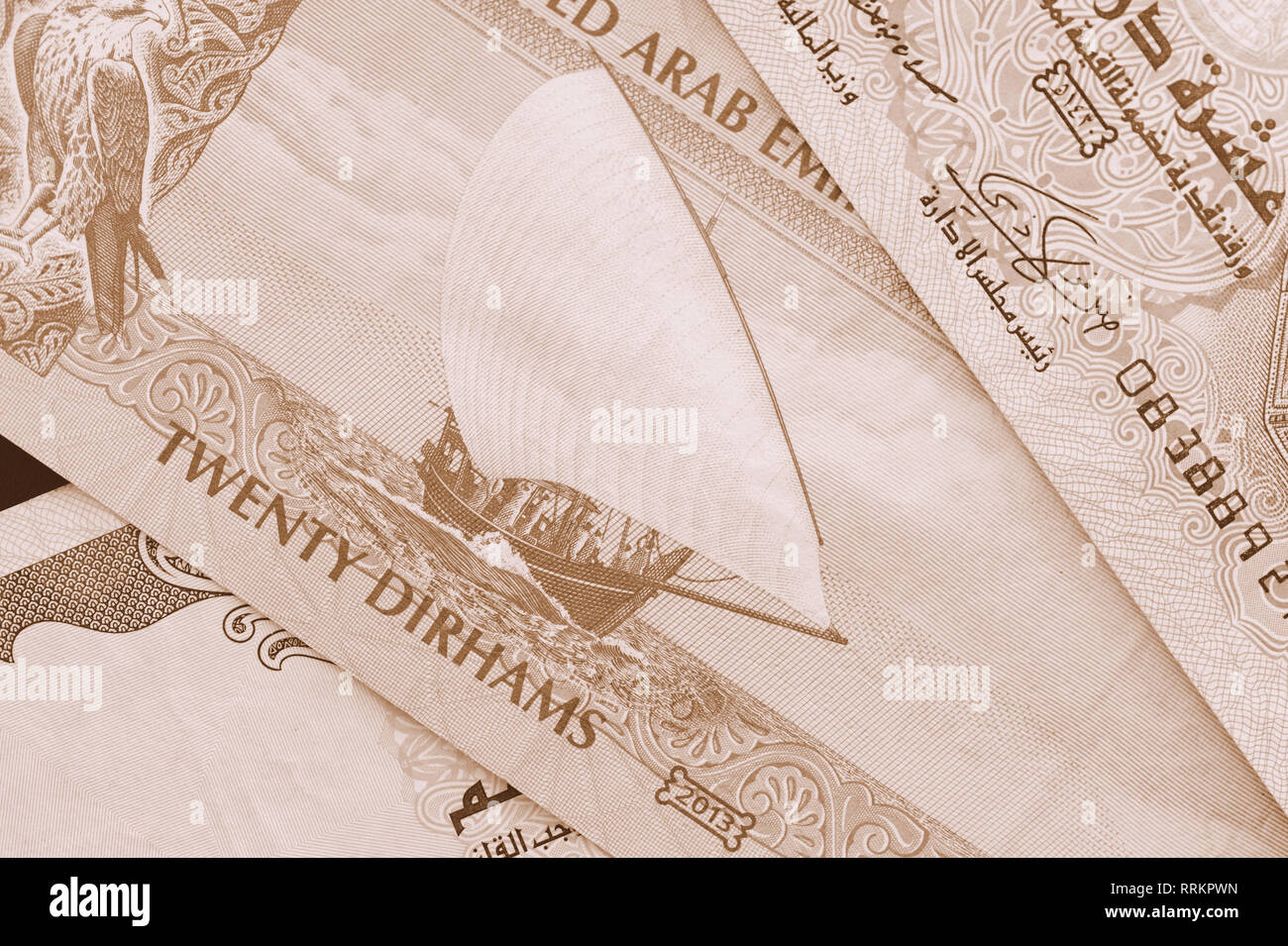 UAE dirham currency background close up. Brown color toned Stock Photo ...
