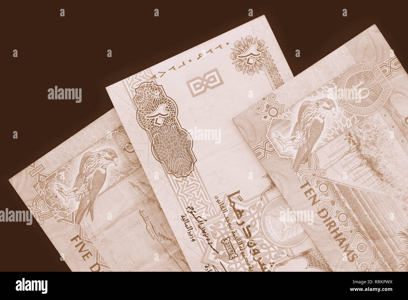 UAE dirham currency background close up. Brown color toned Stock Photo ...