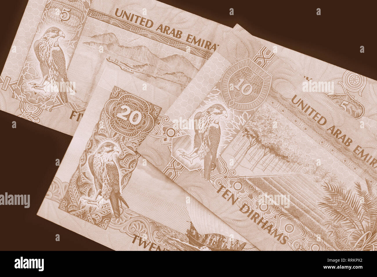UAE dirham currency background close up. Brown color toned Stock Photo ...