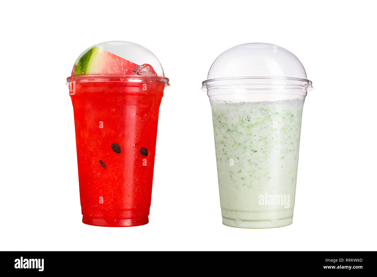 Delicious fruit smoothies in plastic cups, on a white background. Two ...