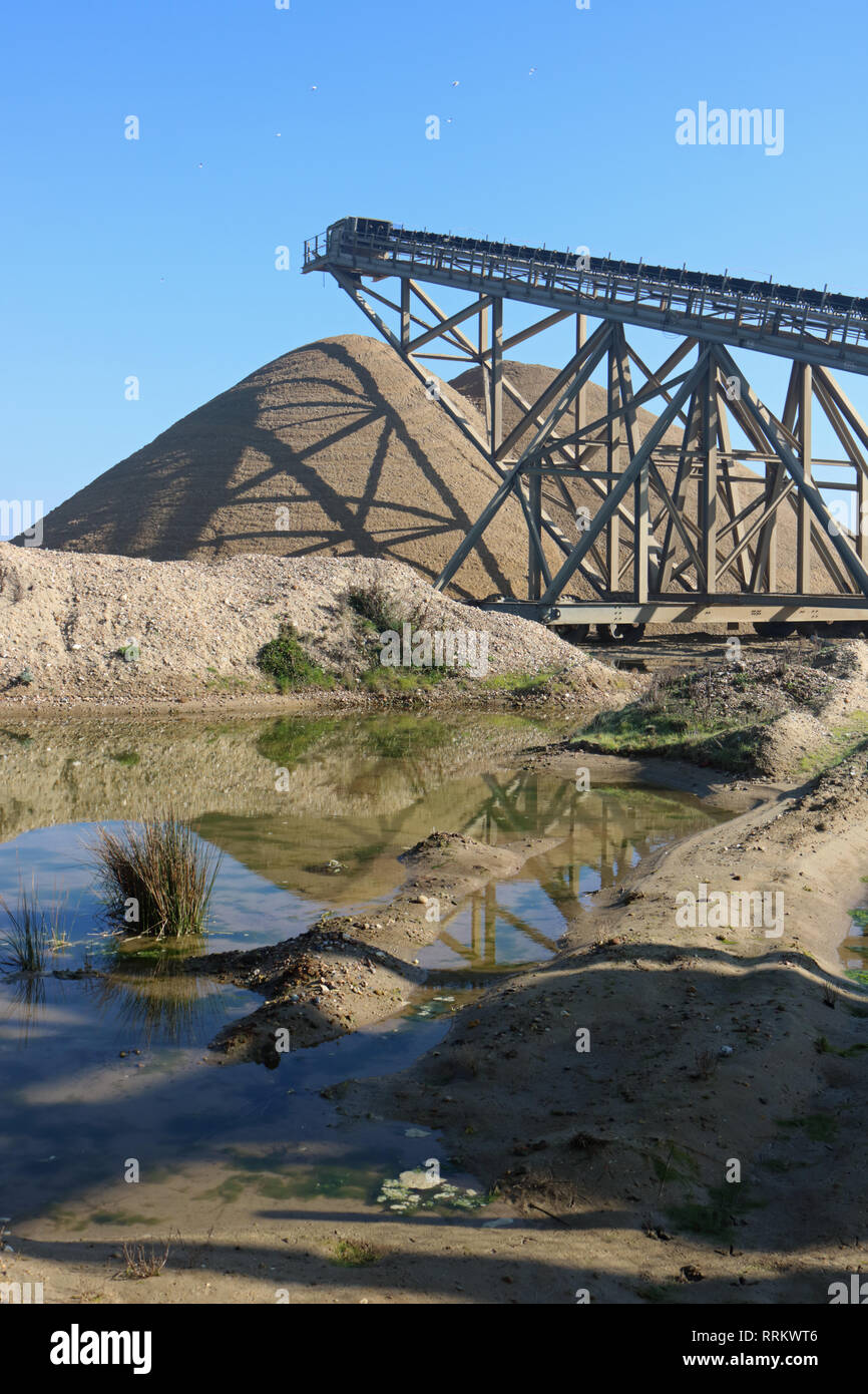 Conveyor and mounds of aggregates at Cliffe sand and gravel works on ...