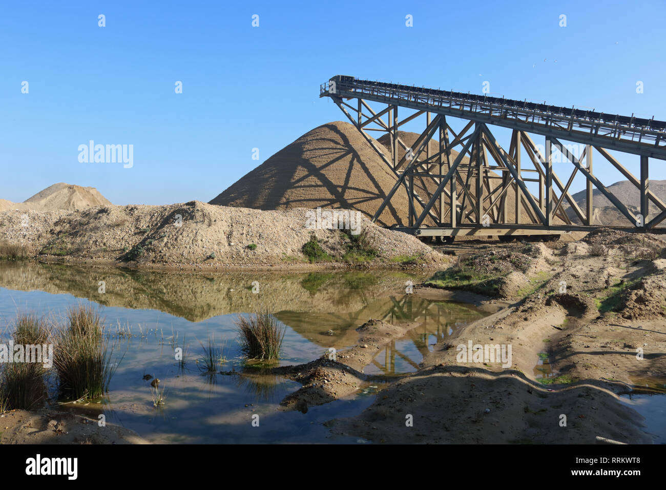 Conveyor and mounds of aggregates at Cliffe sand and gravel works on ...