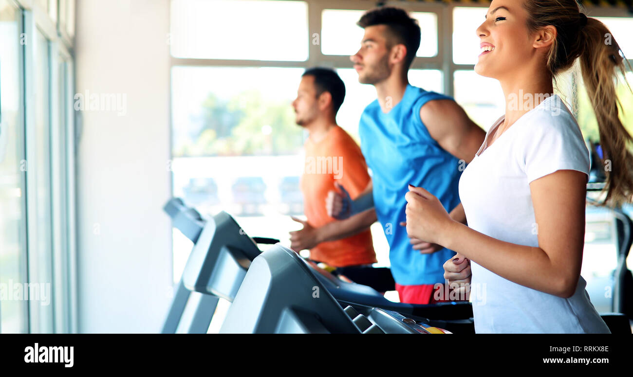 Picture of people running on treadmill in gym Stock Photo - Alamy