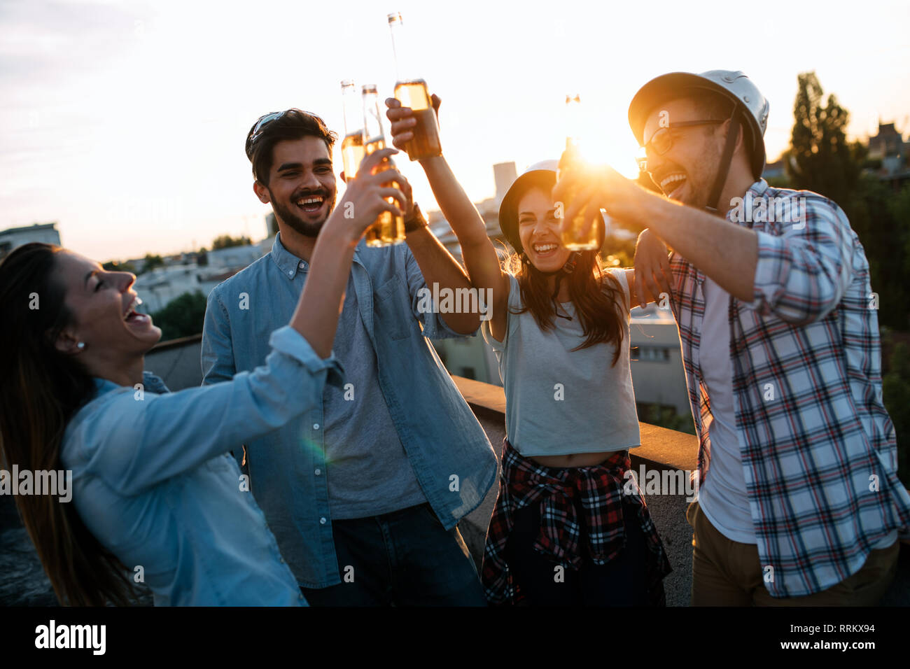 Happy cheerful friends spending fun times together Stock Photo - Alamy