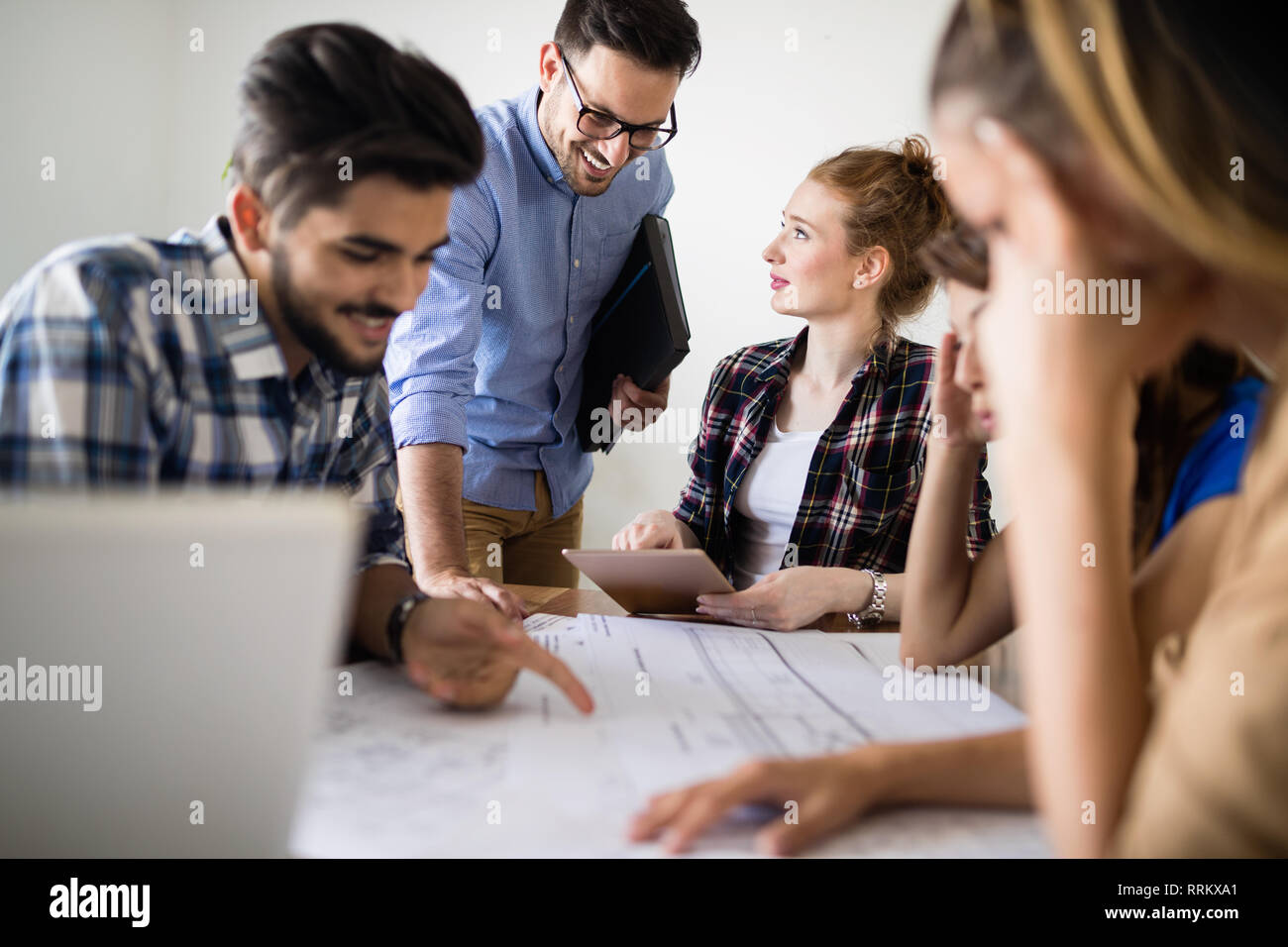 Company coworkers discussing ideas and brainstorming Stock Photo - Alamy