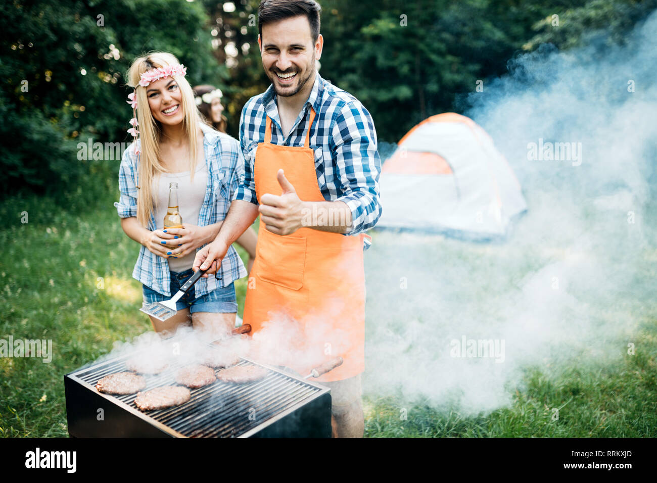 Group people having barbecue hi-res stock photography and images - Alamy