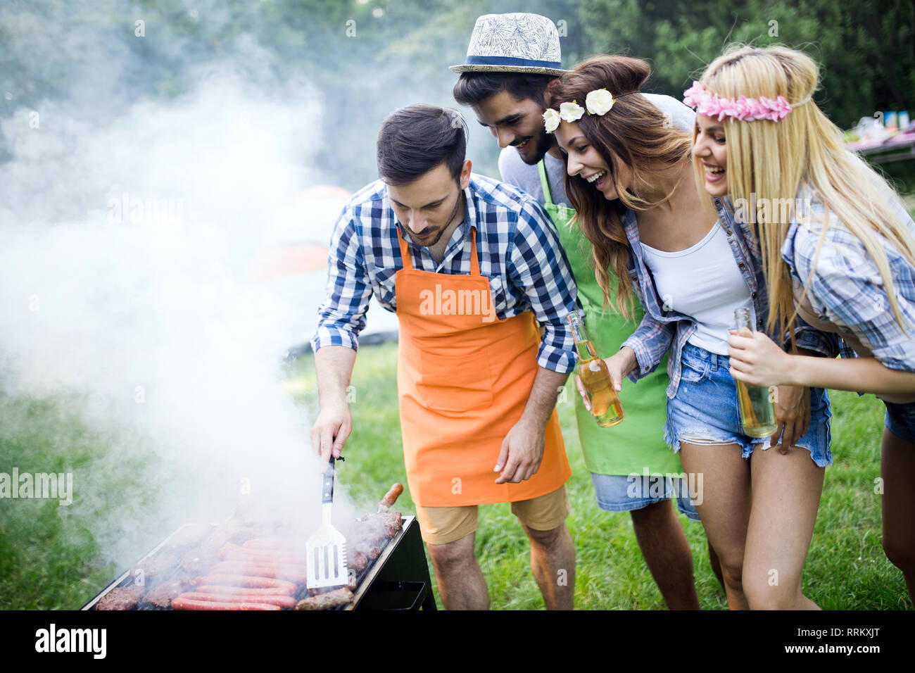 Happy friends barbecue party in hi-res stock photography and images - Alamy