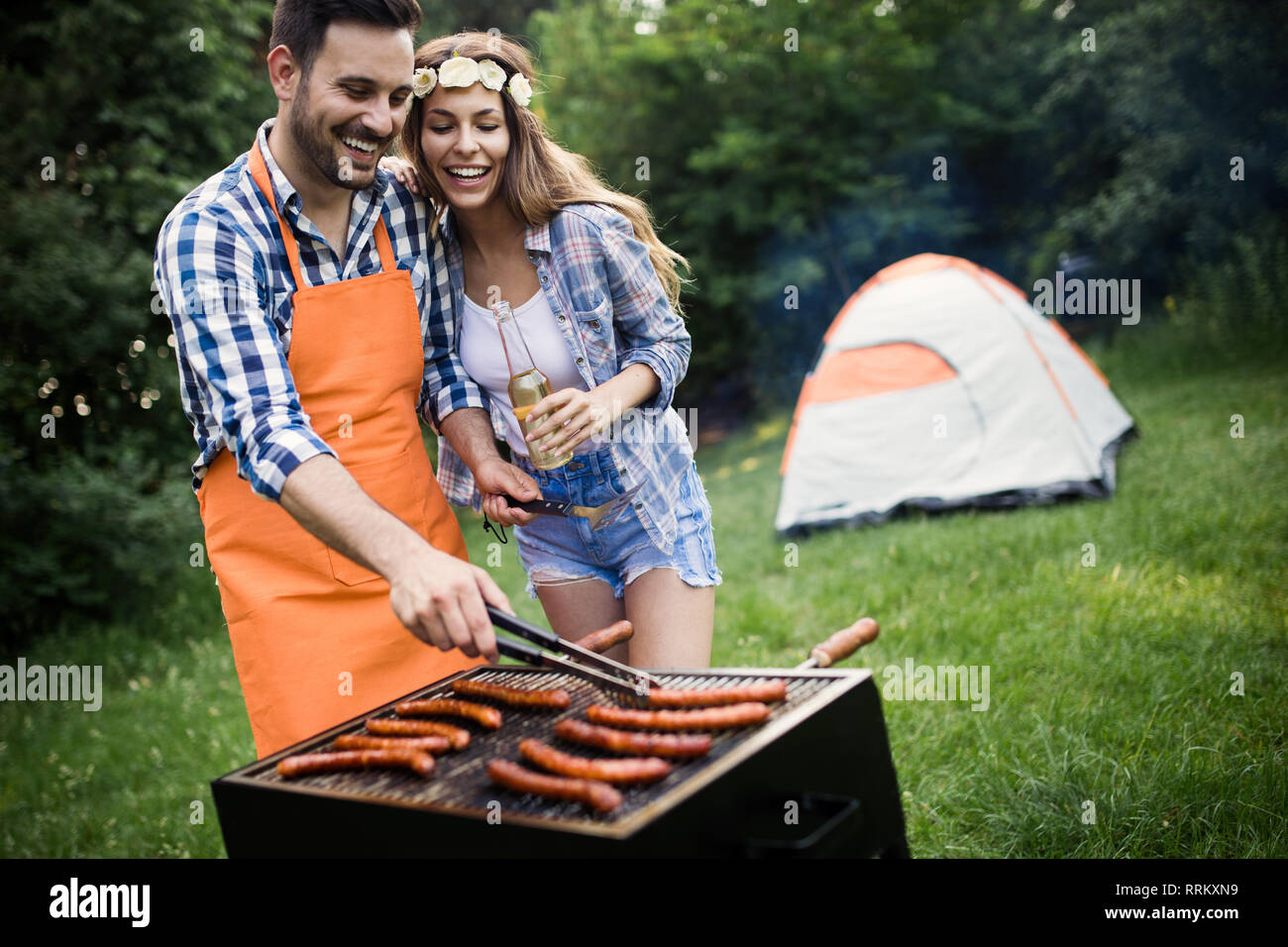 Friends having fun barbecue party hi-res stock photography and images ...