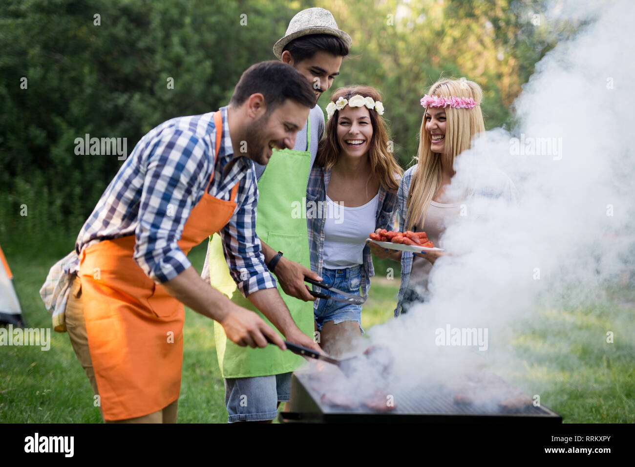 Group people having barbecue hi-res stock photography and images - Alamy