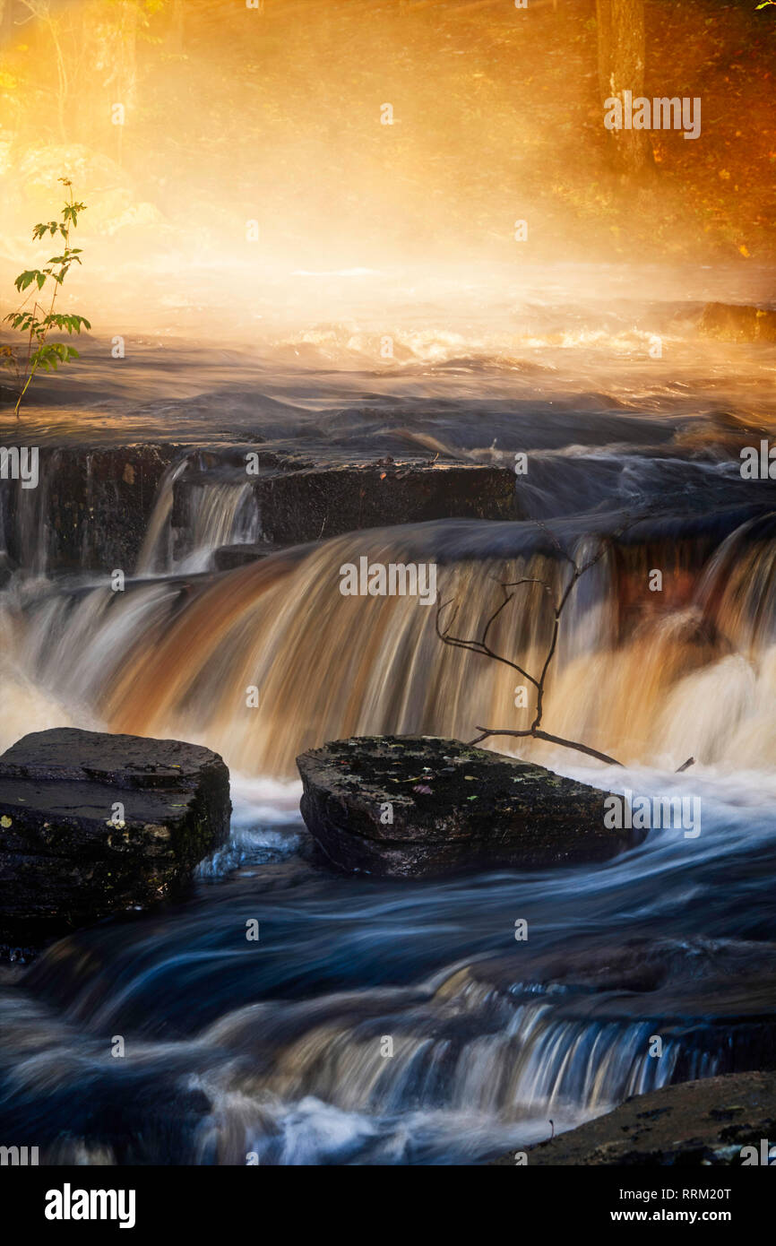 Running water over rocks in a river Stock Photo - Alamy