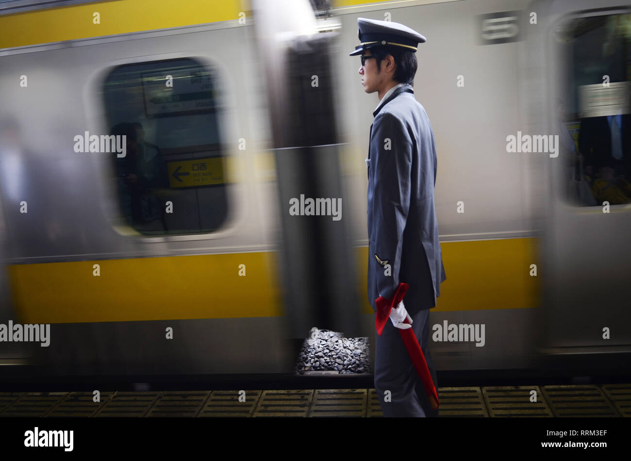 Train station worker, Tokyo Stock Photo - Alamy