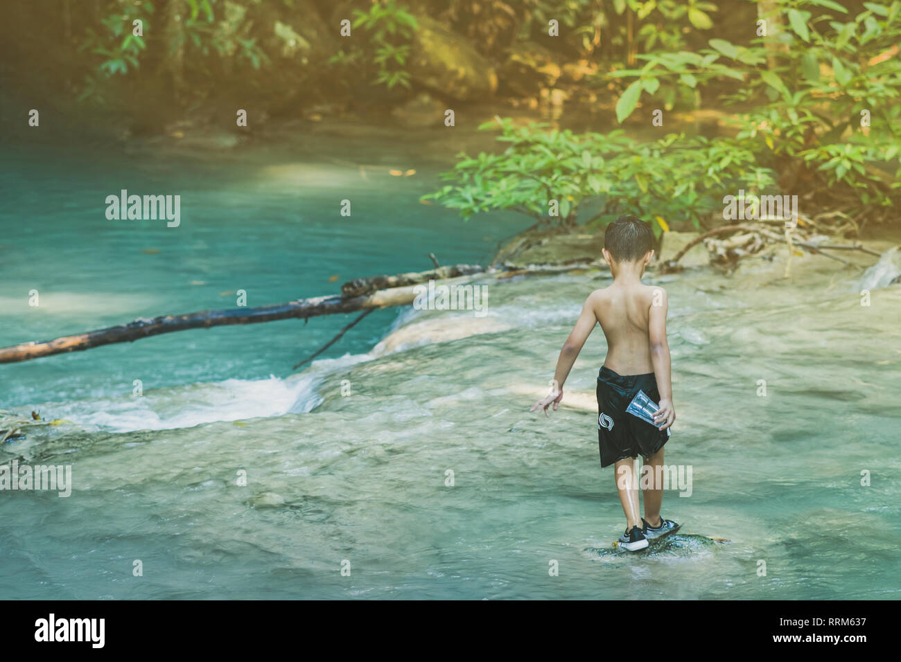 Child Crossing A Stream High Resolution Stock Photography and Images ...