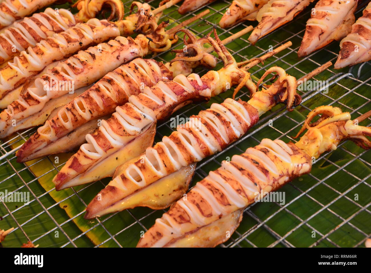 Grilled Squid at street food in Thailand, Sea food on street Stock ...