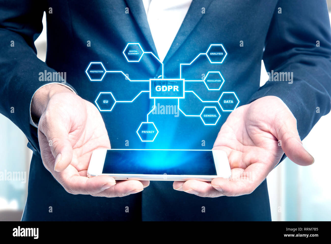 Businessman showing virtual GDPR protection structure from phone screen ...
