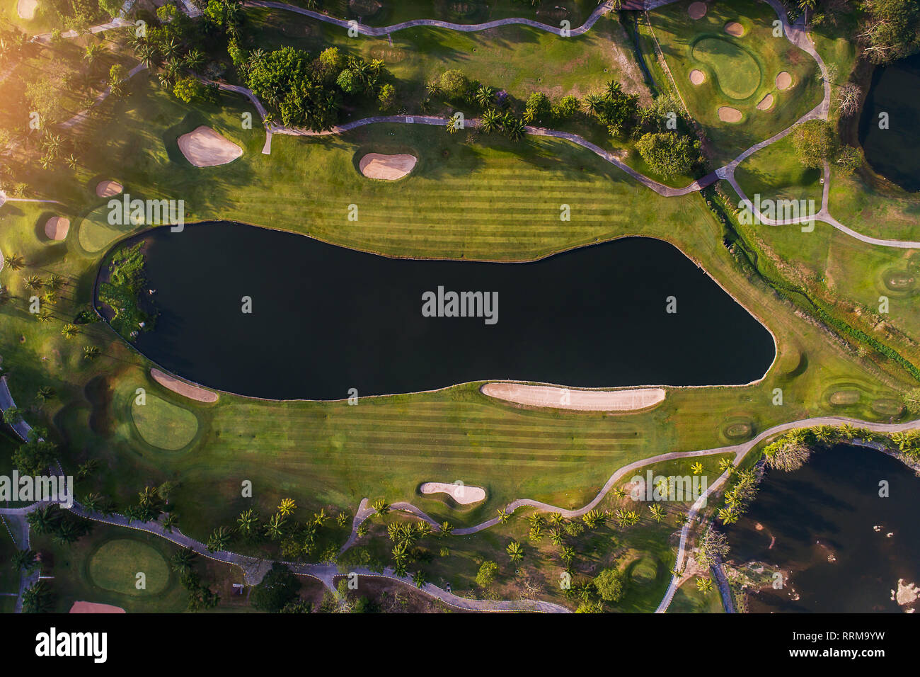 Aerial view photography of forest and golf course with lake. Golf and ...