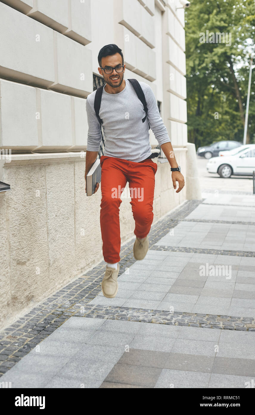 Young happy man running suit hi-res stock photography and images - Alamy