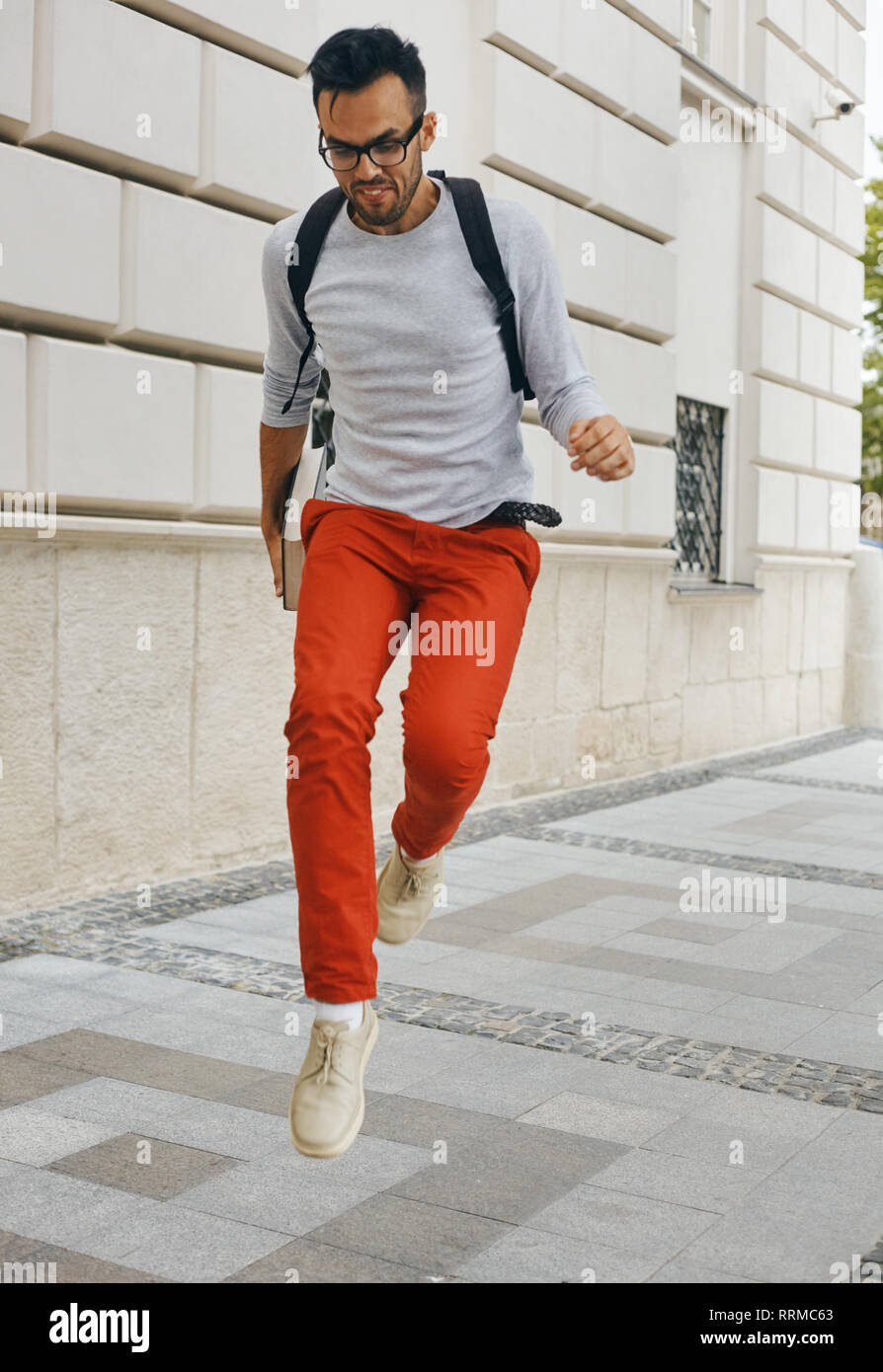 Young happy man running suit hi-res stock photography and images - Alamy