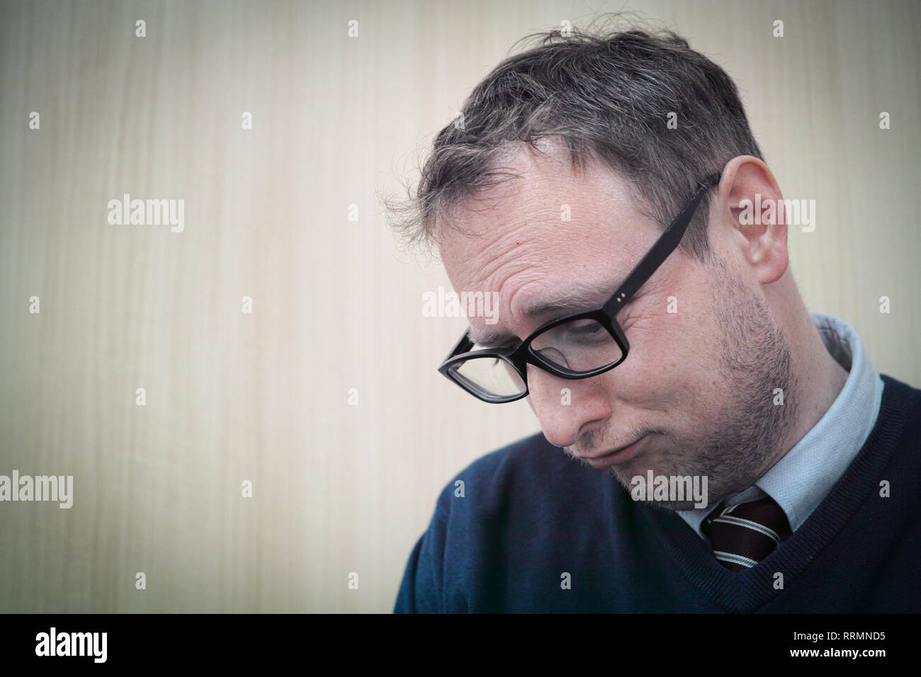 A weird man looking sad at work Stock Photo - Alamy