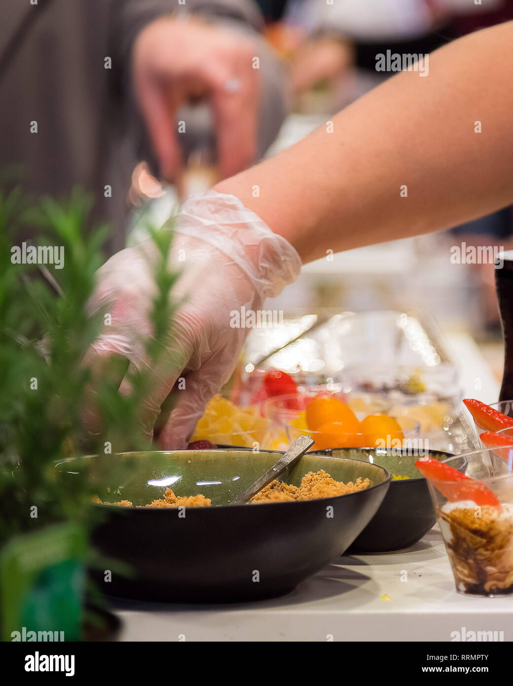 Chef wearing white gloves and standing behind full lunch service ... Chef wearing white gloves and standing behind full lunch service ...