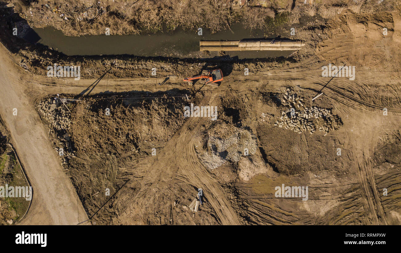 Aerial top view of excavator. On the construction site Stock Photo - Alamy
