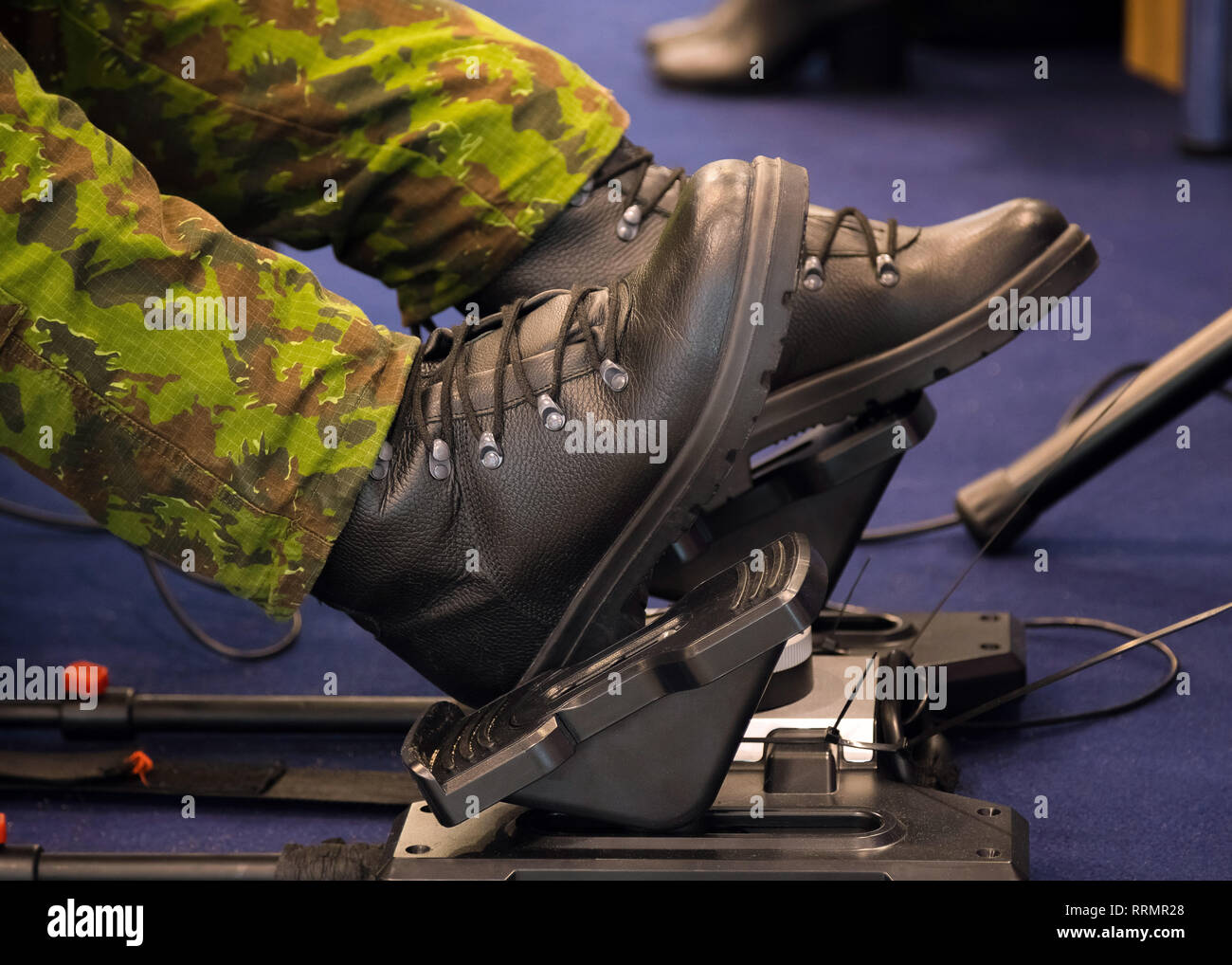 Young soldier training on driving simulator in the cadet corps. Cadet ...