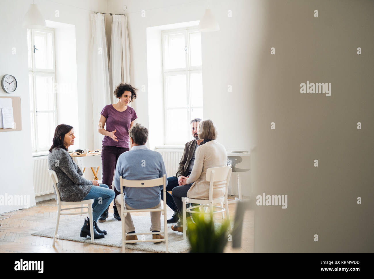 Woman talking therapist during hi-res stock photography and images - Alamy