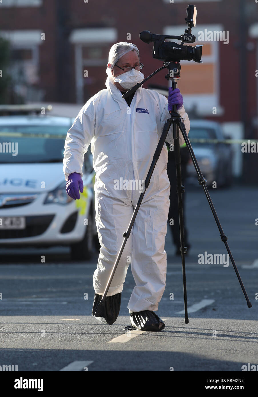 A forensic officer near the scene in Milan Road, Harehills, Leeds ...