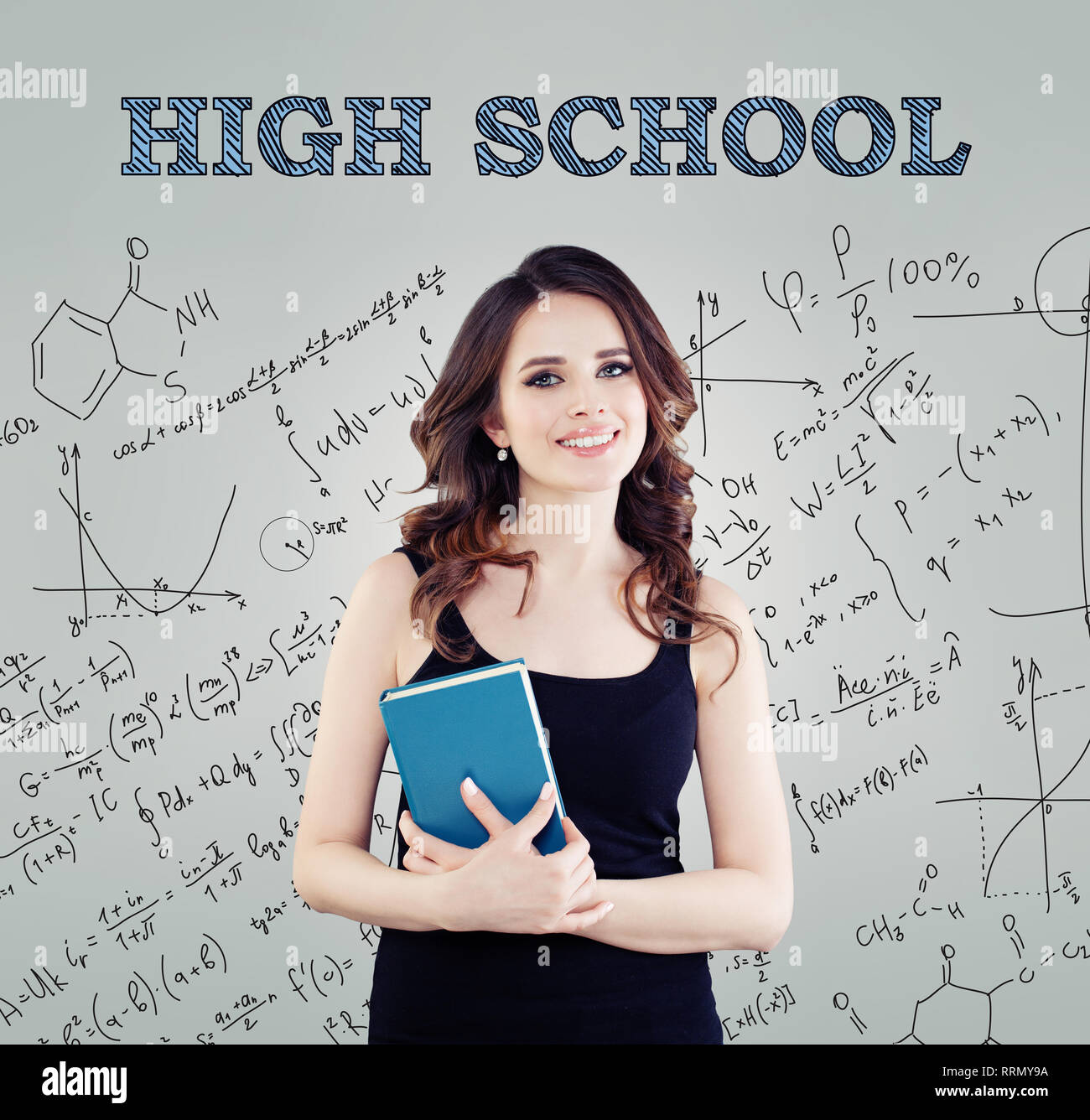 Confident young student woman holding exercise books on science ...