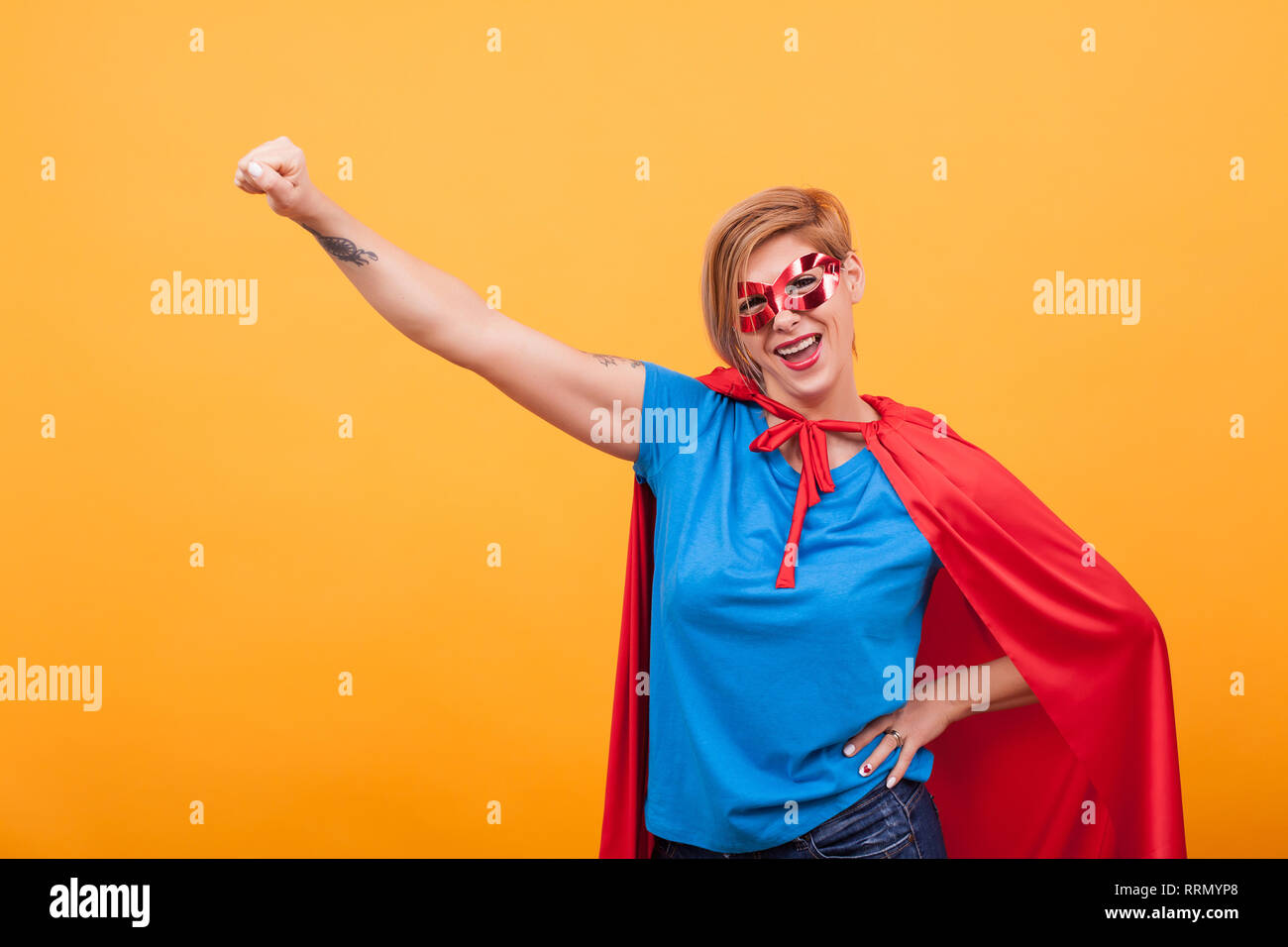 Young woman dresed like superheros flying off to save the world over ...