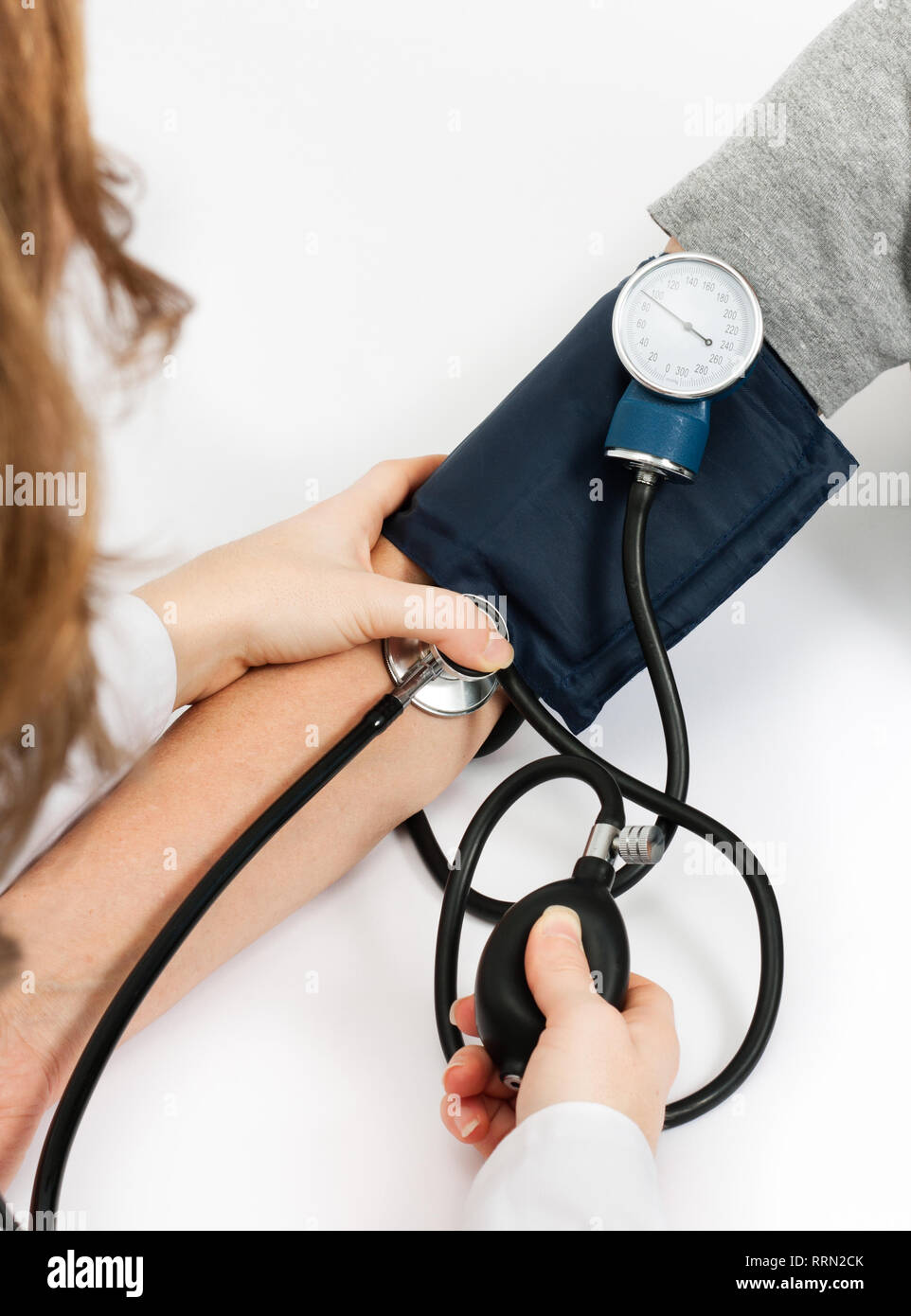 Doctor measuring patient blood pressure with stethoscope Stock Photo Alamy