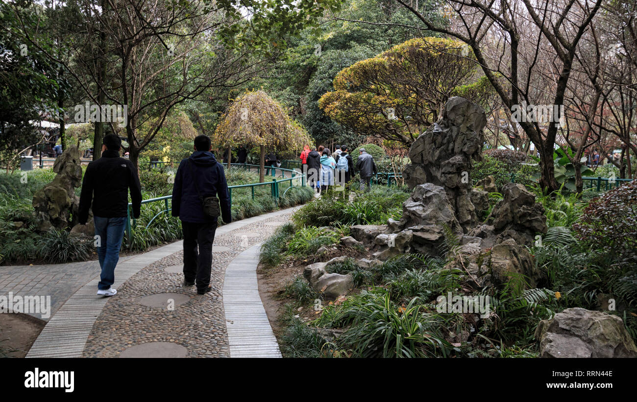 Chengdu, China - December 9, 2018: People walking in the urban park in ...
