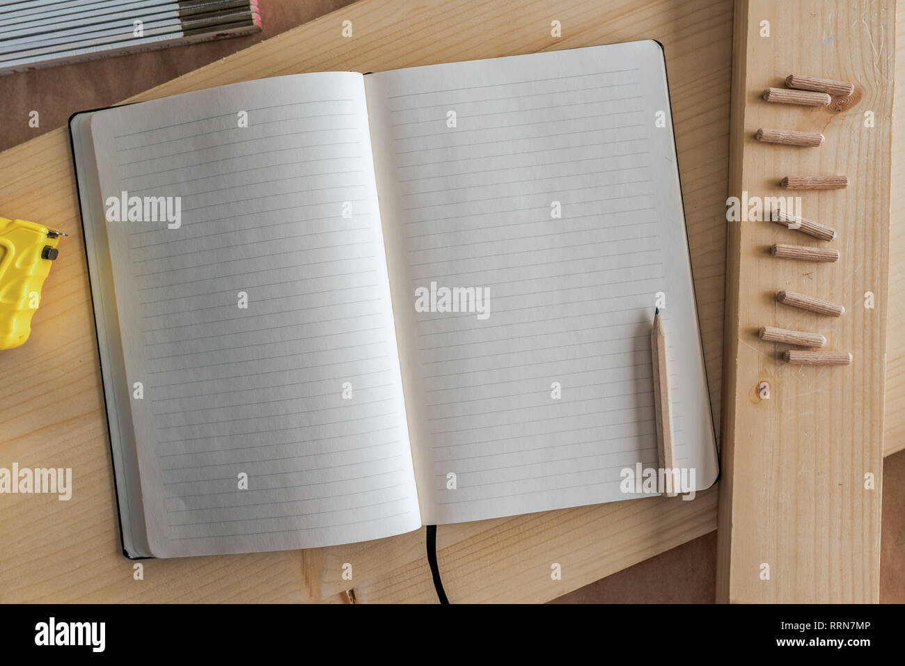 Open note book with blank pages as mock up copy space in woodwork ...