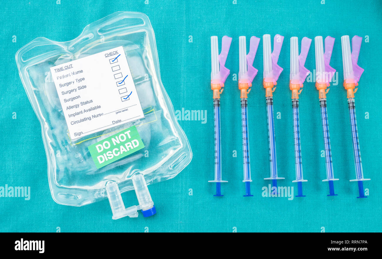 Syringes loaded with medication next to medicine bag prepared in ...