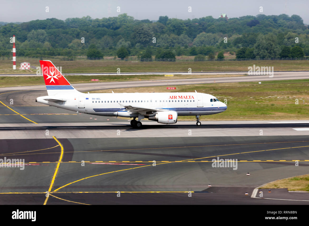Aircraft Airbus A319-111 Air Malta airline on a runway of an airport ...