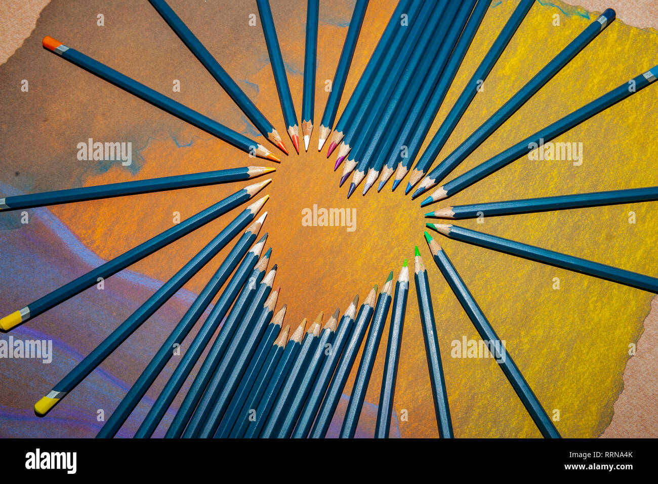 Heart shape made from artist coloured pencils Stock Photo - Alamy