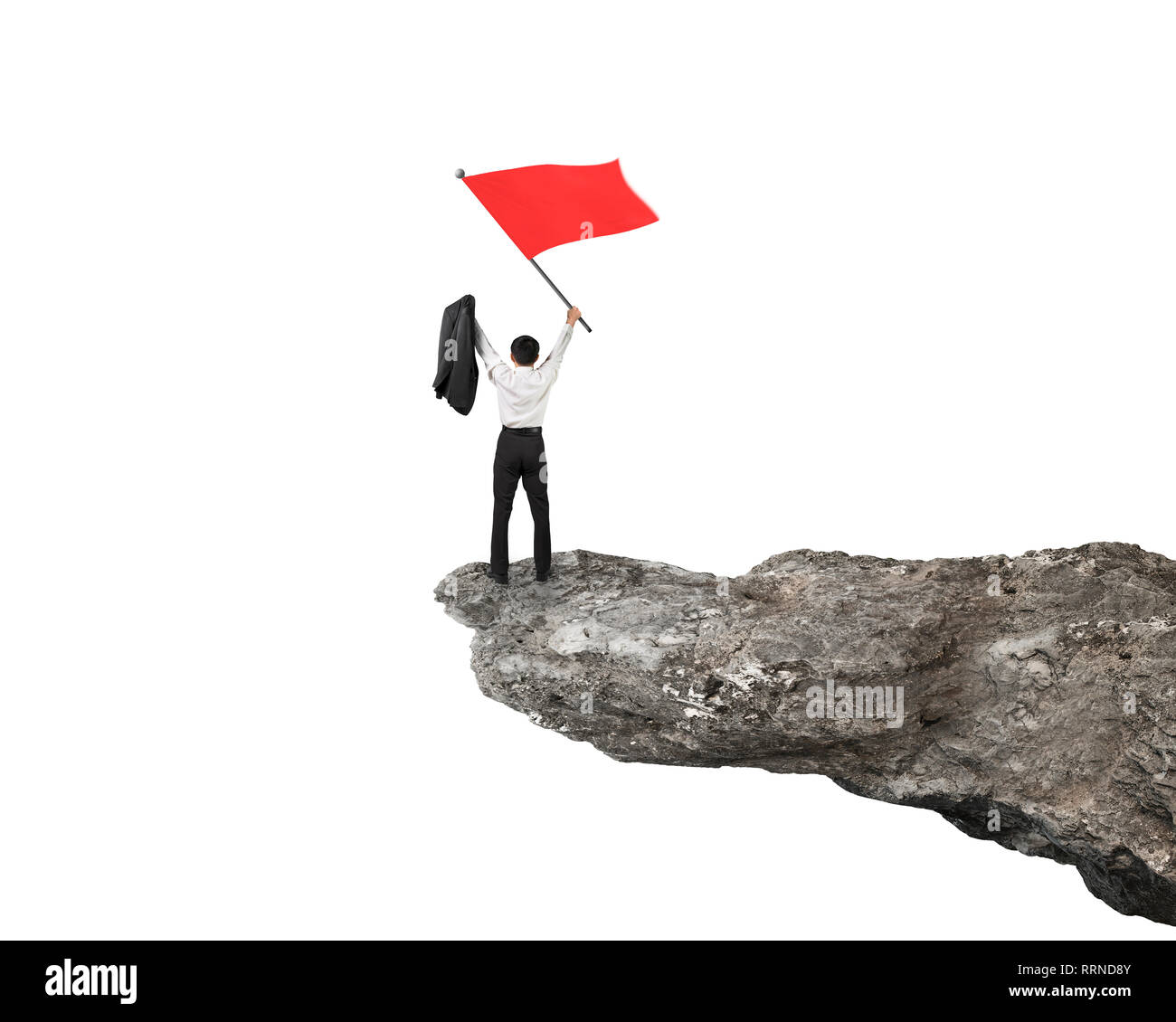Rear view businessman cheering and waving red flag on top of cliff ...