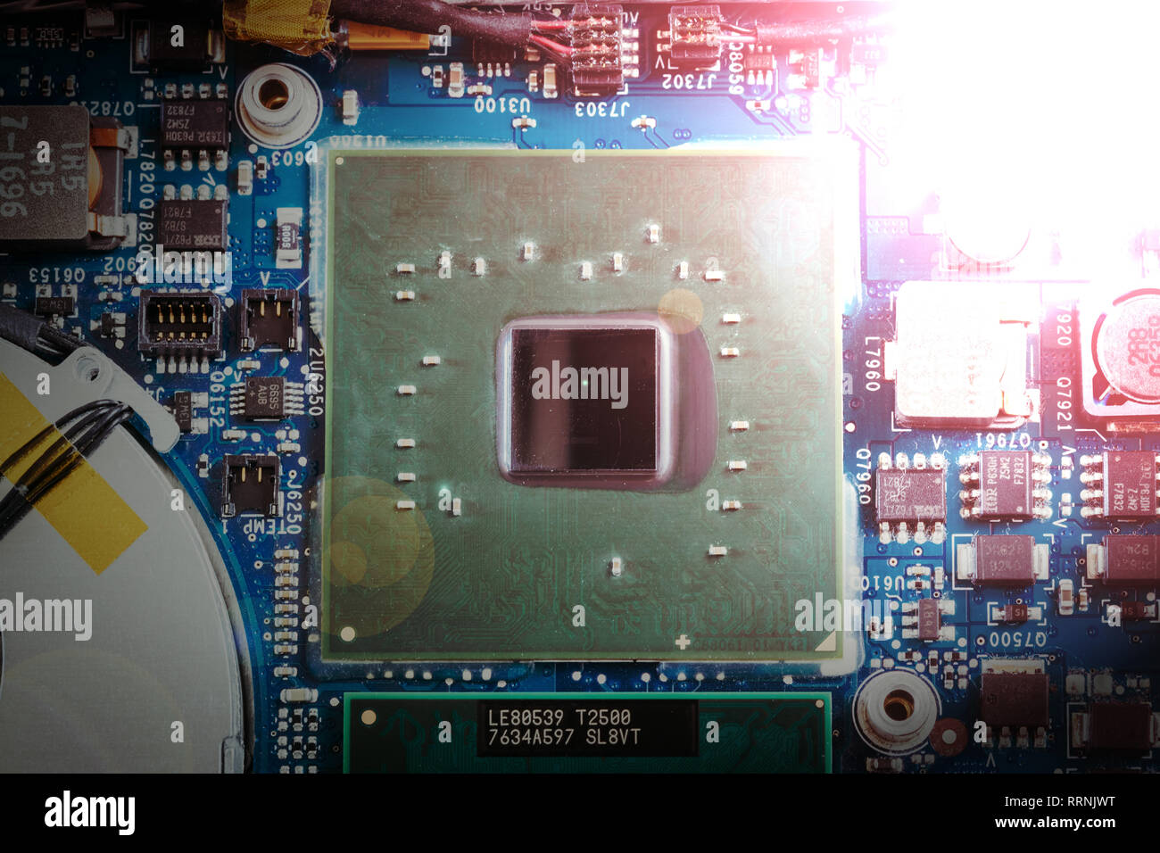 Computer chip on a circuit board, close up with light effect. Computer ...