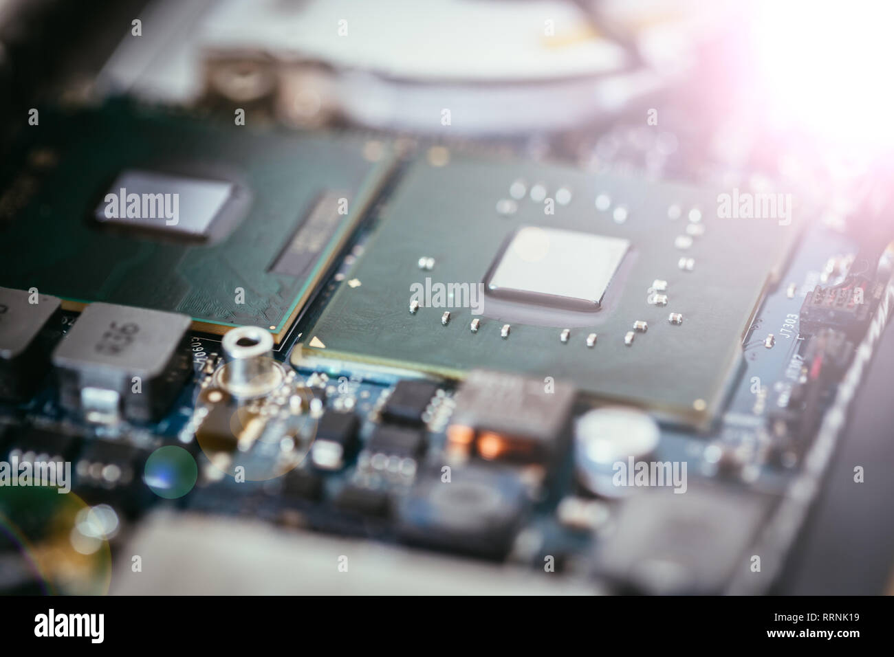 Computer chip on a circuit board, close up with light effect. Computer ...