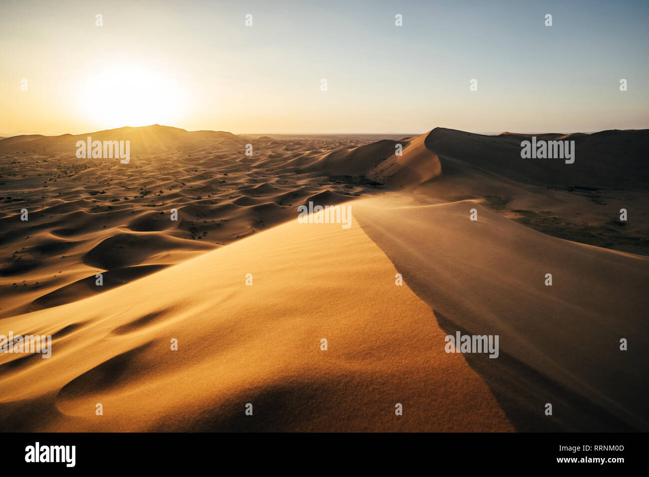 Sun shining over tranquil sandy desert, Sahara, Morocco Stock Photo - Alamy