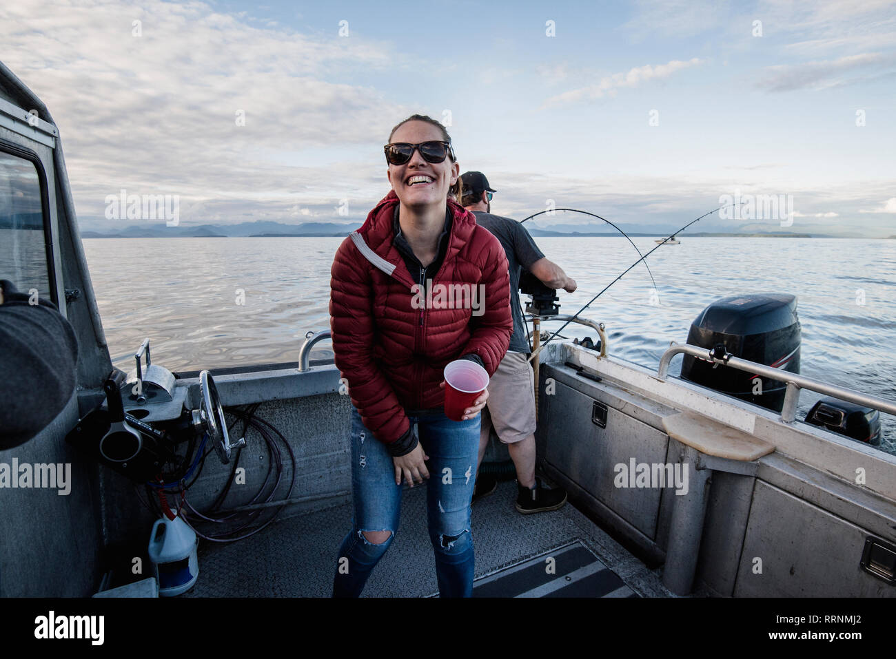 Woman fishing on rod from hi-res stock photography and images - Alamy