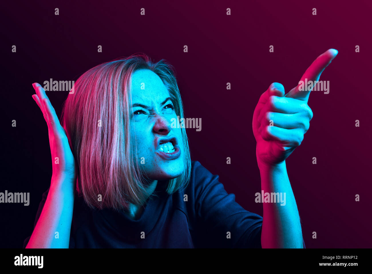 Screaming, hate, rage. Crying emotional angry woman screaming on neon ...
