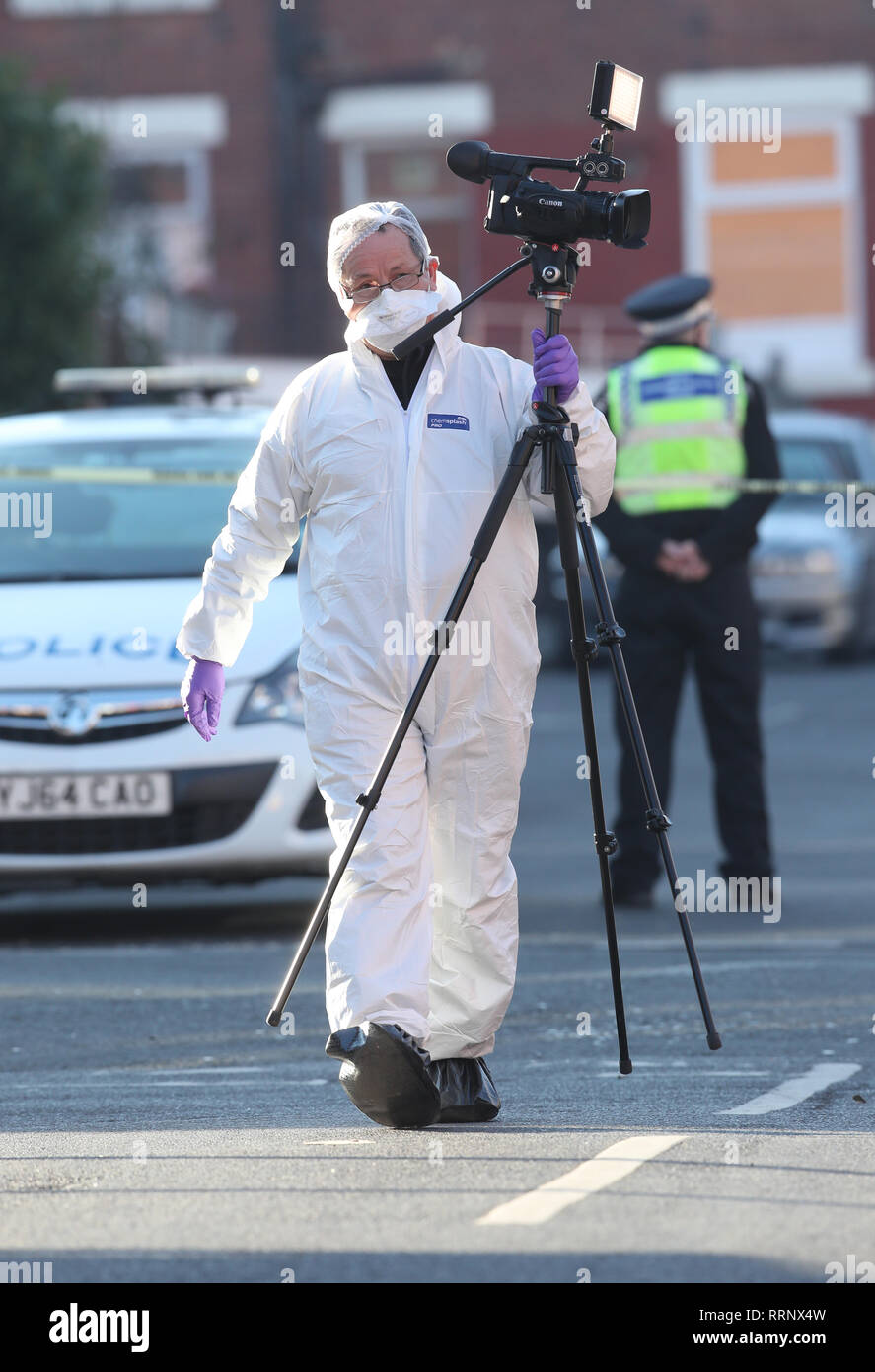 A forensic officer near the scene in Milan Road, Harehills, Leeds ...