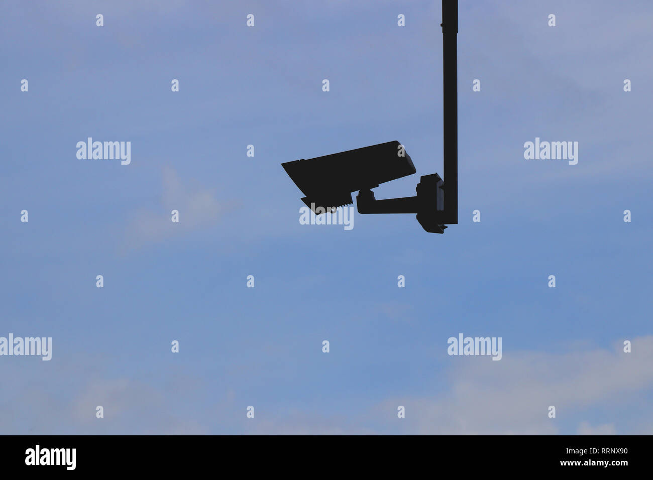 Street camera silhouette on blue sky background. Police protection ...
