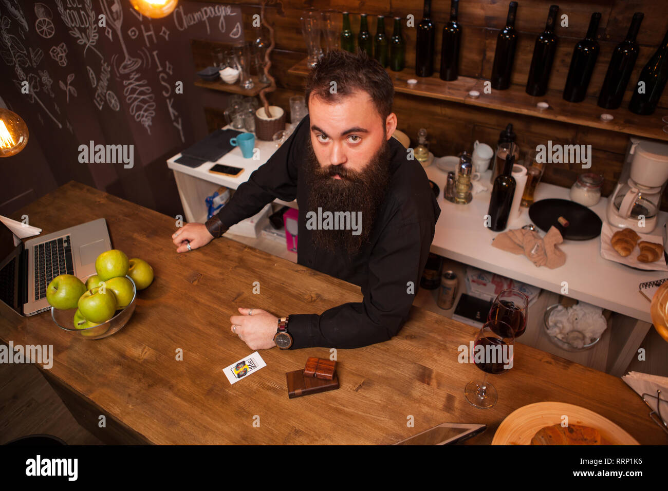 Top view of handsome bartender behind the counter. Young man Stock ...