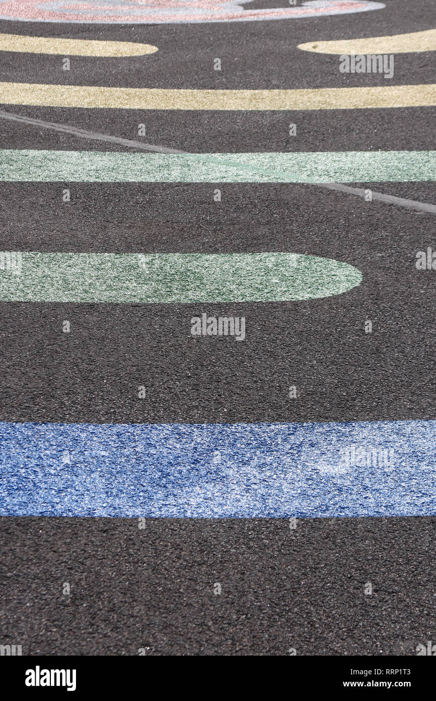 Colored line shapes on asphalt surface texture Stock Photo - Alamy