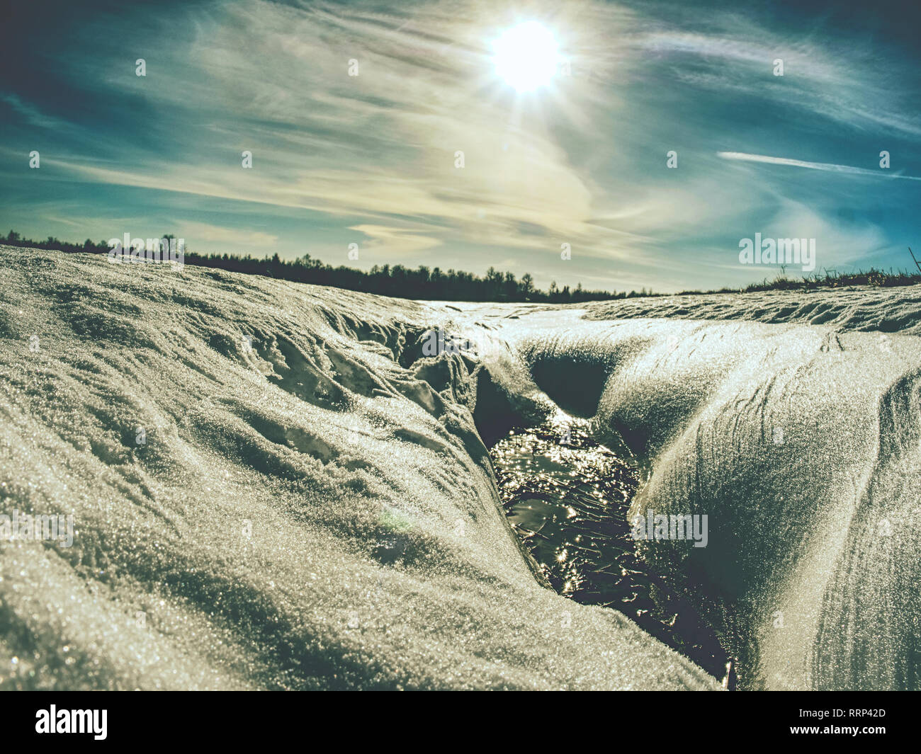 Piece of ice with strong contour and sun flares. Ice crystals on a ice ...