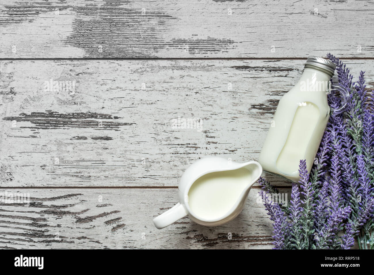 Vintage glass bottle with milk and a beautiful white jug next to a ...