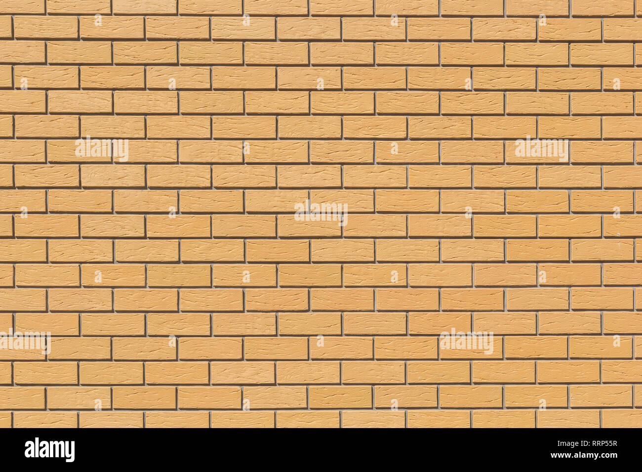 Texture of bright yellow brick Stock Photo - Alamy